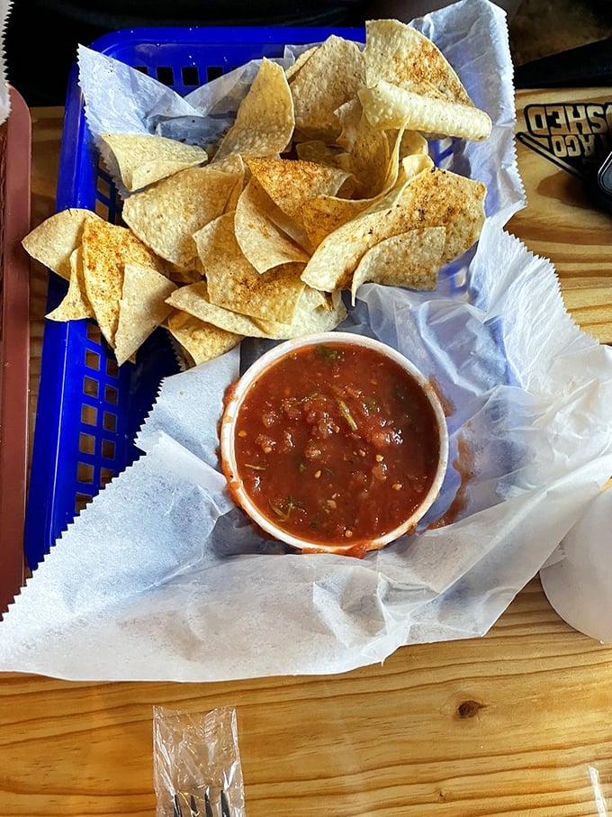 These aren't your sad bar chips with watery salsa. This basket holds the opening act to the main taco event – and it's stealing the show.