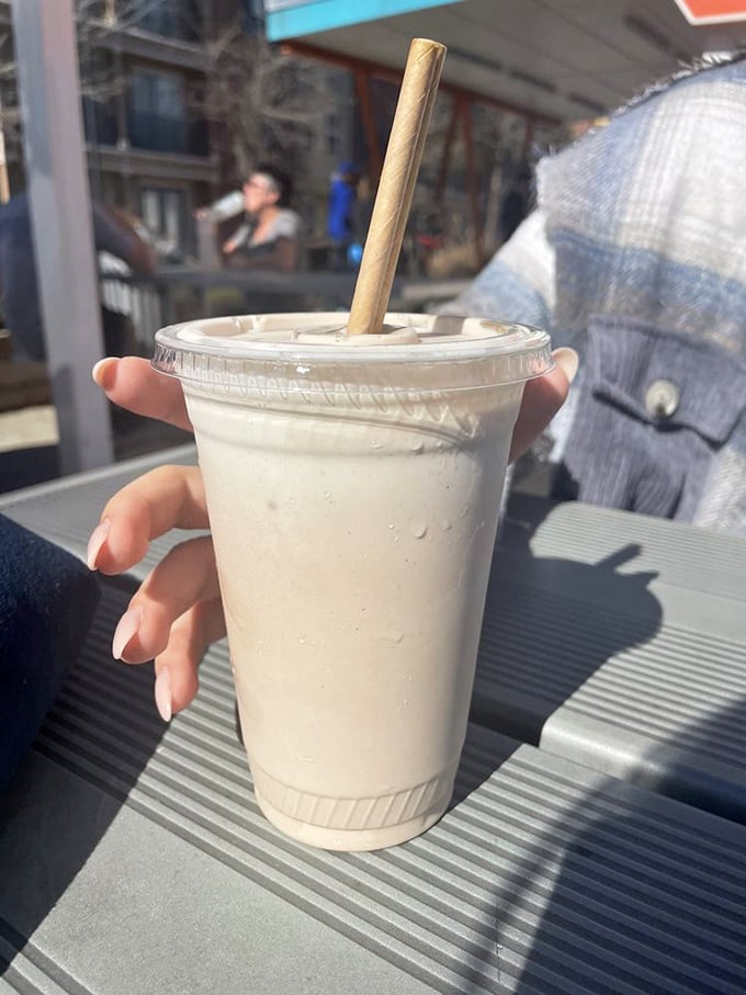 That perfect milkshake moment—thick enough for the straw to stand at attention, yet still sippable. The paper straw adds eco-friendly bonus points.