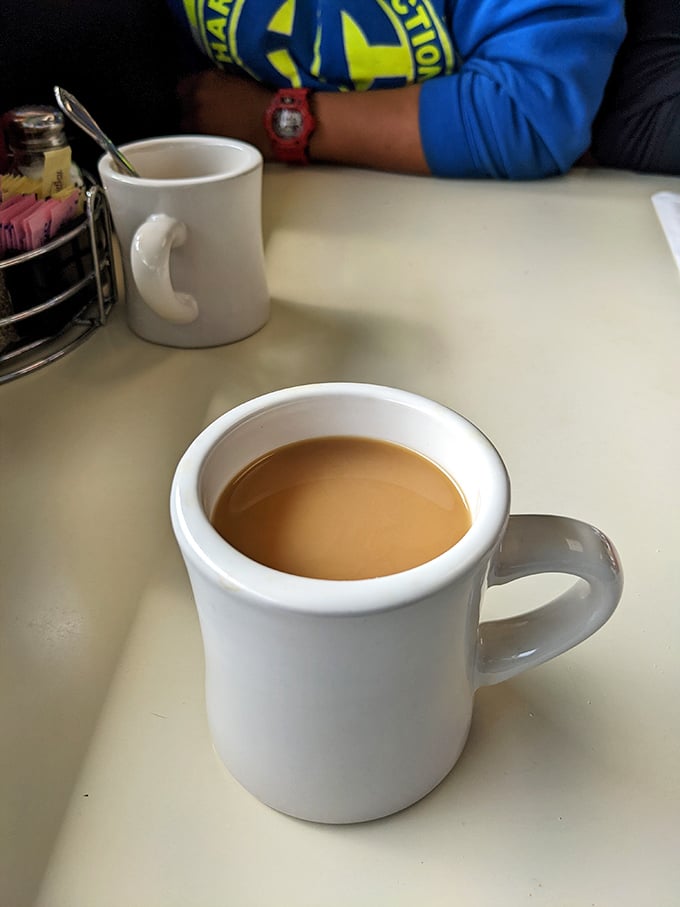 The humble diner mug—holding what might be the most honest cup of coffee in Washington. No pour-over pretension, just reliable caffeination.