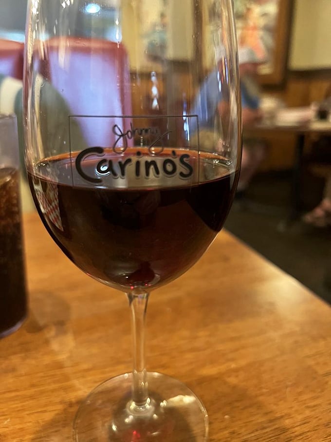Wine with the restaurant's name on the glass—a touch that says, "Go ahead, linger a little longer. Tuesday night deserves to be special."