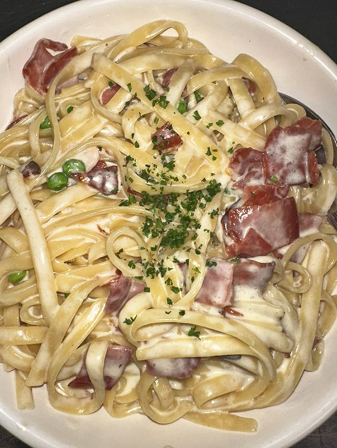 Carbonara that whispers "I've got you" with each creamy, bacon-studded bite—comfort food operating at its highest diplomatic level.