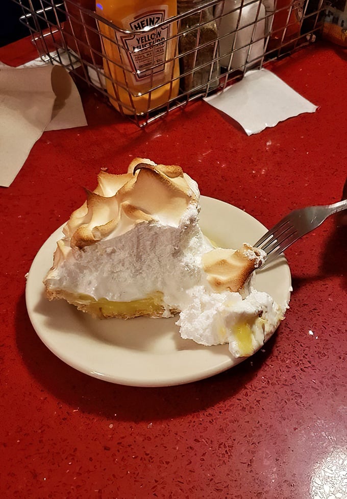 Lemon meringue pie with peaks so high they need their own zip code. That perfect balance of sweet, tart, and cloud-like meringue is diner dessert royalty.