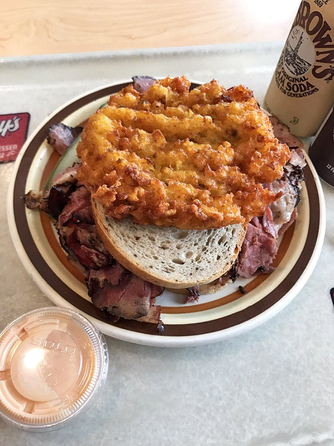 The pastrami pyramid—where meat is stacked with such generosity that one sandwich becomes dinner tonight and tomorrow's lunch.