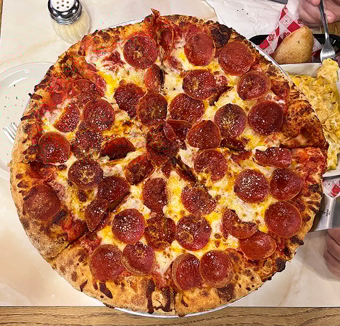 Pepperoni pizza perfection that would make even New Yorkers nod in reluctant approval. The crispy-edged pepperoni cups holding tiny pools of savory goodness.