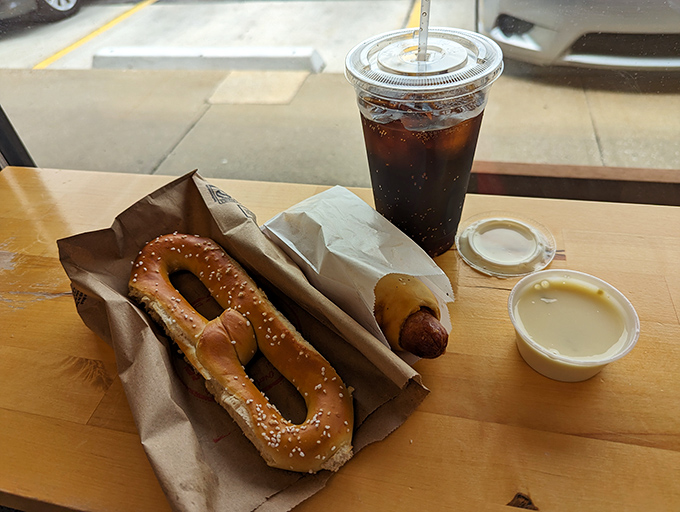 The perfect trifecta: pretzel, pretzel dog, and soda. Some call it lunch; I call it achieving the carbohydrate dream.