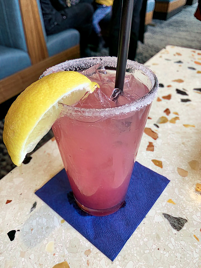 This isn't just raspberry lemonade—it's summer in a glass, with a salt rim that reminds you the ocean is just steps away.