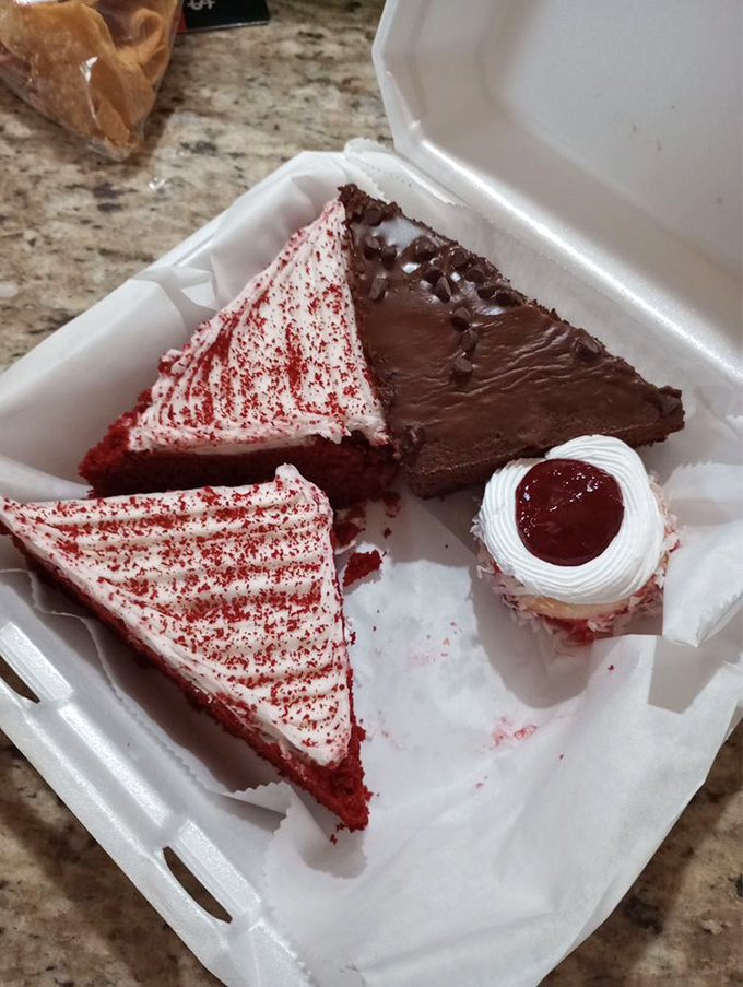 A dessert rainbow in a box—red velvet, chocolate fudge, and a cherry-topped treat make this the adult version of a treasure chest.