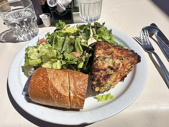 Quiche that makes you question everything you thought you knew about breakfast. That side salad? Just there to ease your conscience.