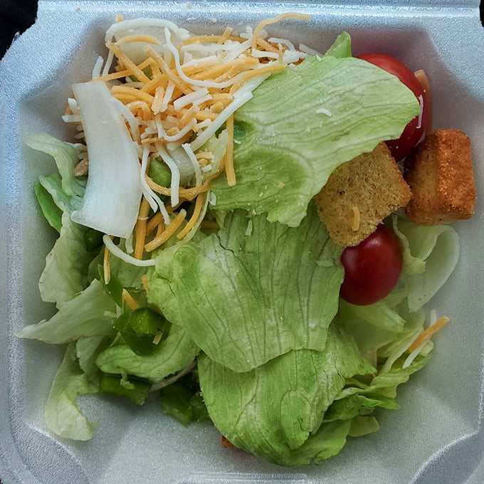 A side salad that somehow manages to be both virtuous and satisfying. Those croutons aren't from a box—they've got stories to tell.