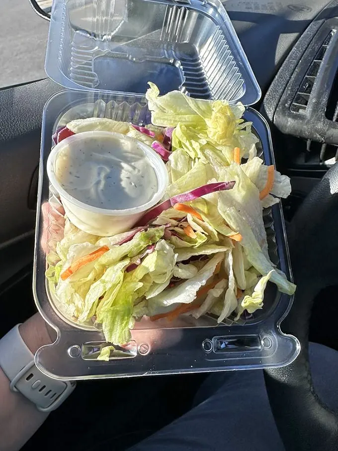 Even the side salad knows its role—a crisp, cooling interlude between magnificent carb movements in this symphony of Italian-American comfort food.