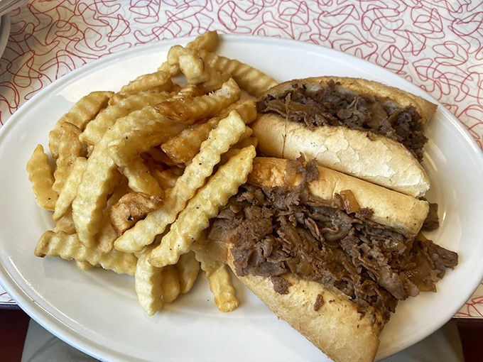 A proper steak sandwich should require both hands and several napkins. This beauty, with its mountain of crispy fries, delivers on that sacred promise.
