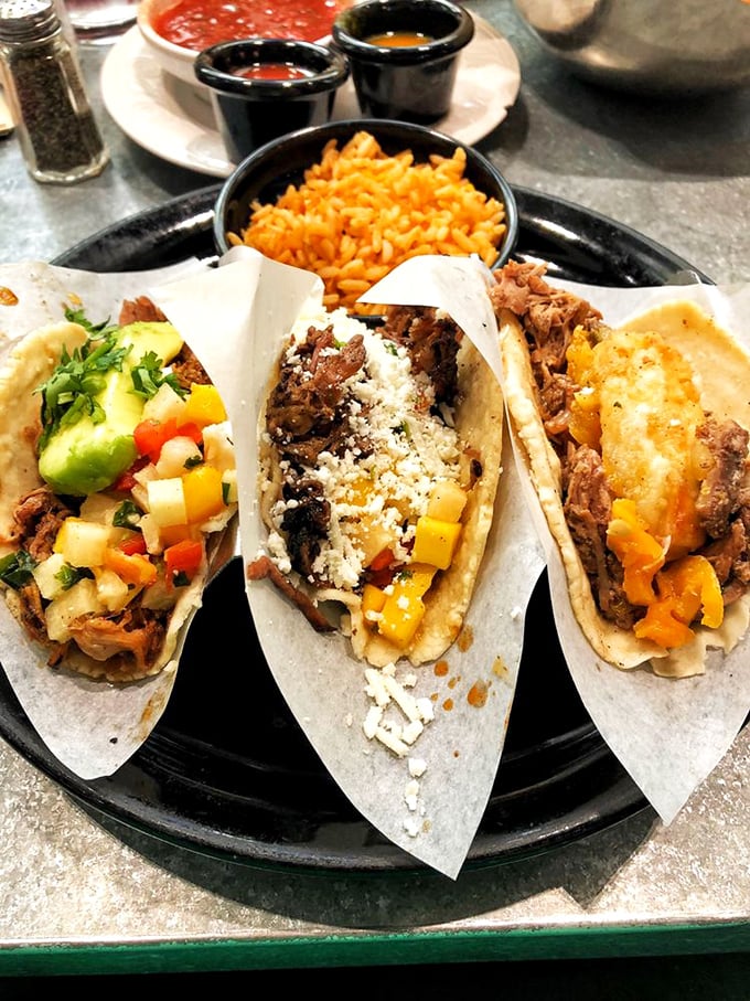 Three amigos on a blue plate, each with its own personality. That lime wedge isn't just garnish—it's the conductor of this flavor orchestra.