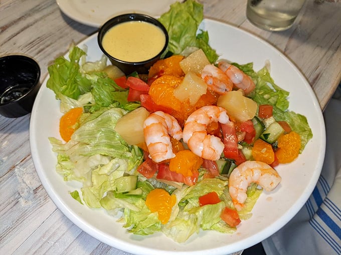 A tropical salad that brings sunshine to your table, regardless of the weather outside. Those shrimp look like they're having fun.