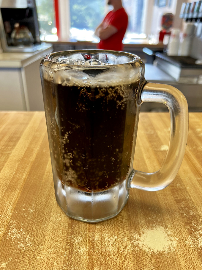 That frosted mug of house-made root beer isn't just a drink—it's a creamy, spiced time machine that takes you back to simpler days with every sip.