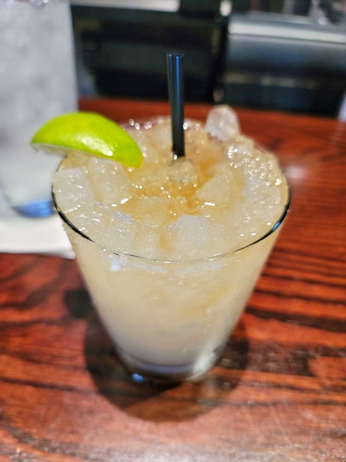 The forgotten art of the perfect cocktail lives on here. That lime wedge isn't just garnish—it's the exclamation point on a well-crafted sentence.