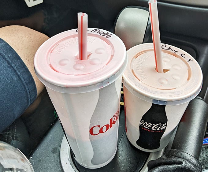 Classic sodas in those perfectly tapered cups—where the last sip somehow tastes better than the first. The plastic straw feels rebelliously nostalgic.