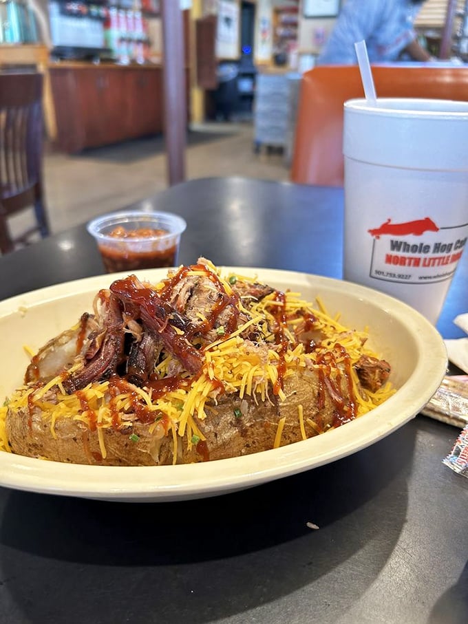 The loaded baked potato – where humble spud meets smoky aristocracy. Topped with meat, cheese and sauce, it's comfort food elevated to art form.