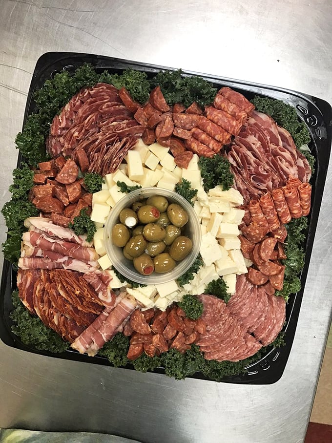 At the center of it all, those green olives stuffed with pimento—the unsung heroes of any respectable deli platter. Simple perfection that elevates everything around it.