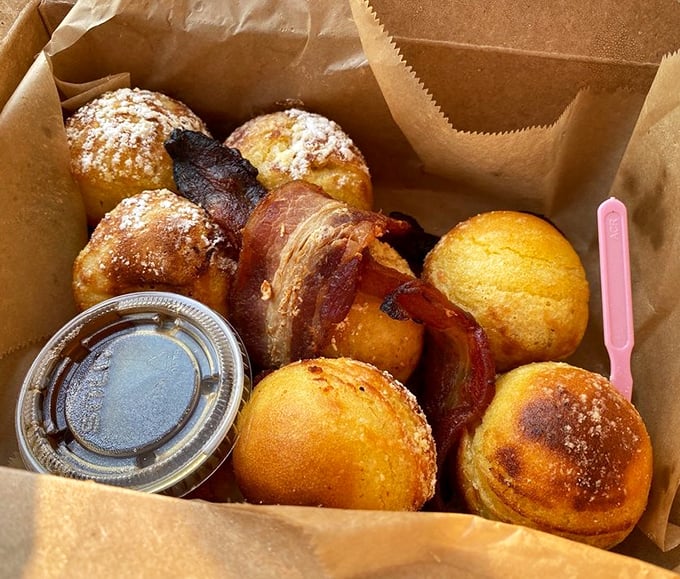 Pancake balls—little spheres of joy dusted with powdered sugar and served with bacon that's been elevated to an art form.