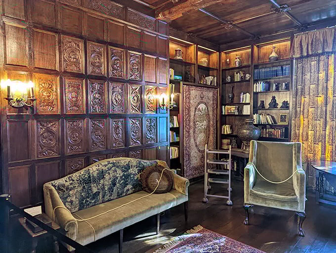 Intricate wood paneling transforms this intimate reading room into a cocoon of culture—the kind of space where you'd expect to find leather-bound first editions and well-kept secrets.