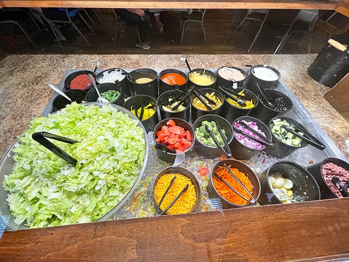 The salad bar—an unexpected treasure trove of freshness with enough toppings to make your inner salad architect absolutely giddy with possibility.