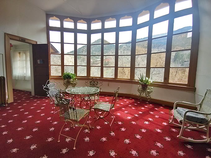 The solarium's curved windows frame the Colorado mountains like a Victorian Instagram filter—#NoFilterNeeded, just architectural brilliance.