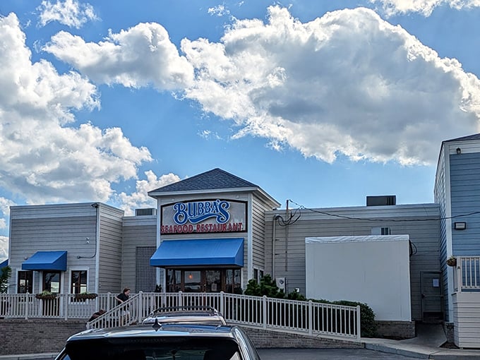 Bubba's clean white exterior with blue awnings promises seafood without pretense—just the way the locals like it.