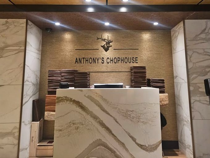 Marble elegance meets seafood excellence at Anthony's reception desk – where steak house meets ocean treasures.