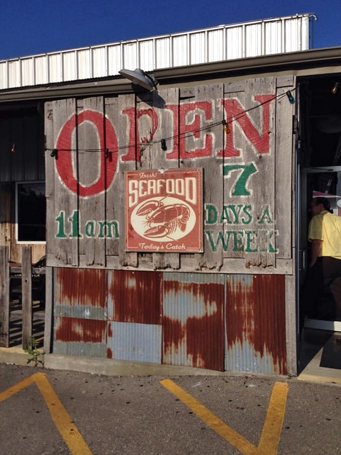 This isn't just a sign—it's a wooden promise of crispy, cornmeal-crusted happiness waiting inside.