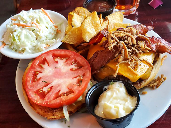 A burger that defies gravity with its towering toppings—proof that landlubbers can find happiness at a seafood joint after all.