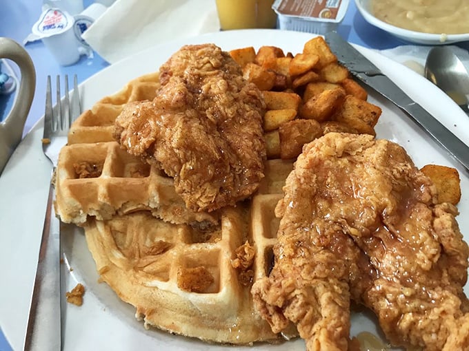 Chicken and waffles: the breakfast equivalent of a power couple. That golden-fried chicken perched atop Belgian waffle real estate is pure morning magnificence.