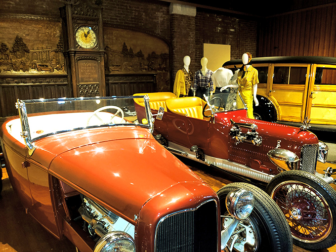 A vibrant display featuring mannequins dressed in period attire alongside their equally stylish automotive counterparts—fashion and function beautifully merged.