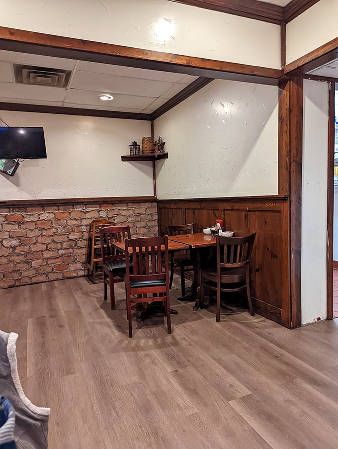 Every great diner has that perfect corner booth where the wood meets brick, creating a cozy nook for lingering conversations and extra coffee refills.