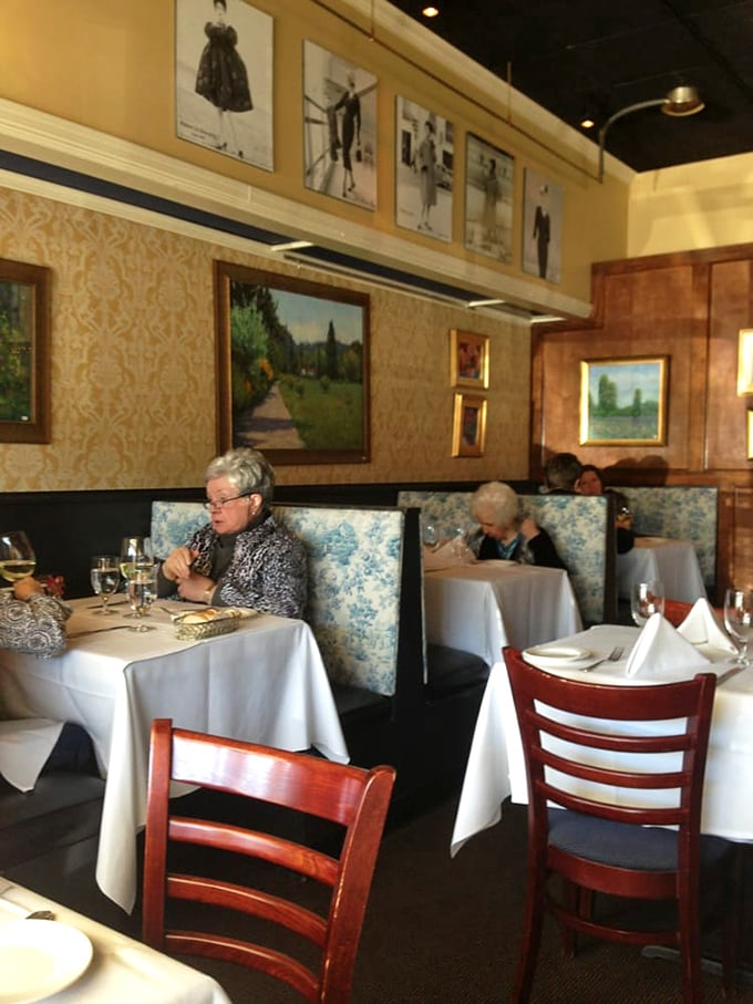 Blue toile banquettes and carefully curated artwork transport diners to a Parisian bistro—no passport required, just a healthy appetite and dinner reservation.