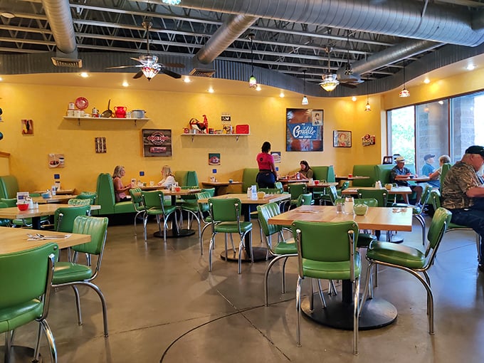 The dining room—where strangers become neighbors and the cheerful yellow walls seem to amplify the morning sunshine.