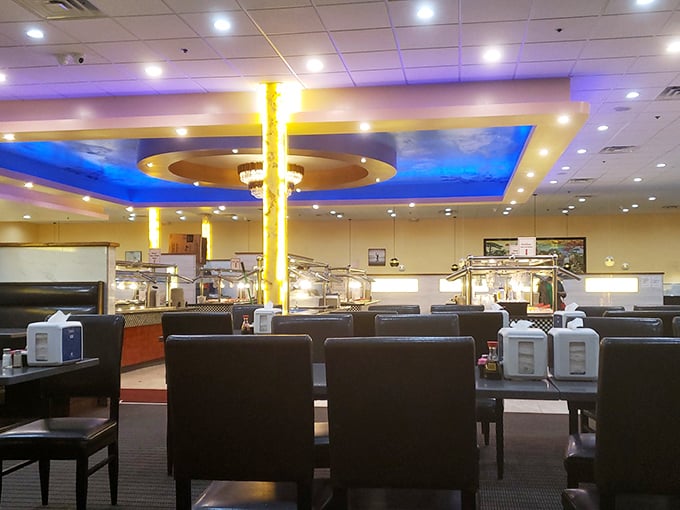 The dining area blends comfort with efficiency, where the blue-sky ceiling detail and golden pillars create an atmosphere that says, "Take your time, but remember—other hungry people are waiting."