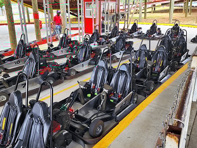 A fleet of go-karts stands ready for action – each one harboring the potential to make accountants drive like NASCAR hopefuls and teenagers suddenly obey rules.