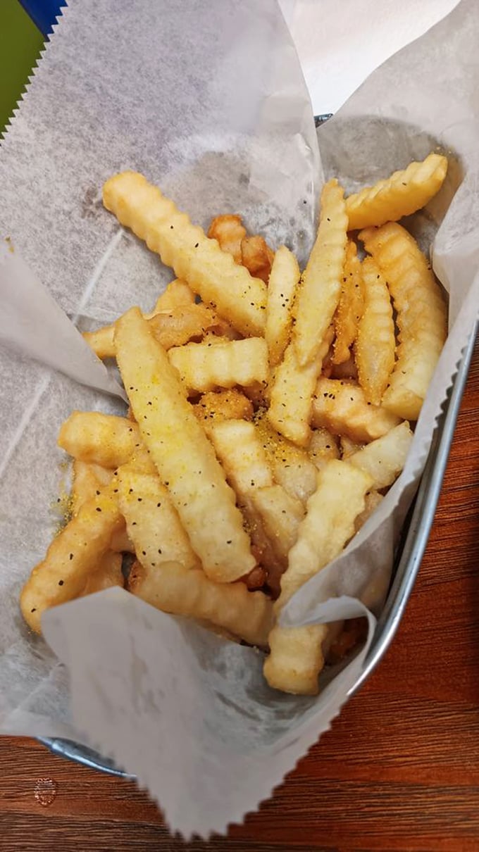 These aren't just fries—they're golden, crispy vehicles engineered specifically for transporting seasoning to your soul. No ketchup required.