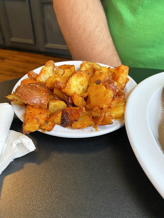Home fries that have achieved that mythical balance – crispy edges, tender centers, and seasoned by someone who understands potato perfection.