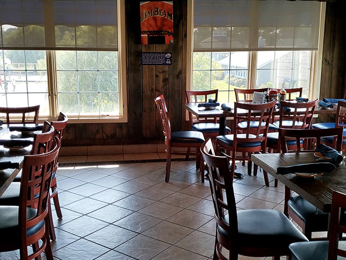 The sunlight streaming through windows transforms this dining room into a cathedral of comfort, where barbecue prayers are answered daily.