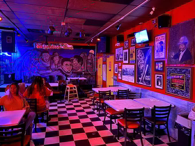The checkered floor and blues memorabilia create the perfect backdrop for what's about to be the messiest, most satisfying meal of your week.