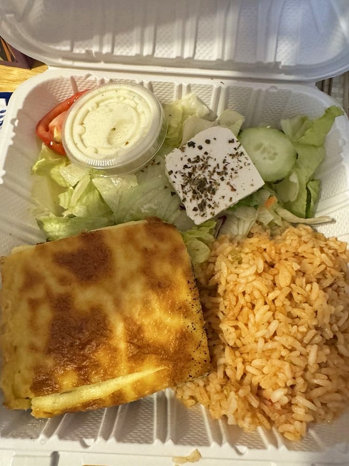 Not all heroes wear capes—some come in takeout containers. This moussaka with Greek salad and rice is comfort food that travels well.