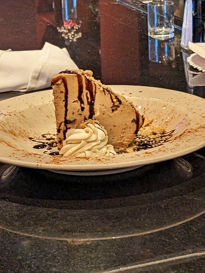 A slice of peanut butter pie that doesn't just satisfy your sweet tooth—it throws a party for it, complete with chocolate drizzle confetti.