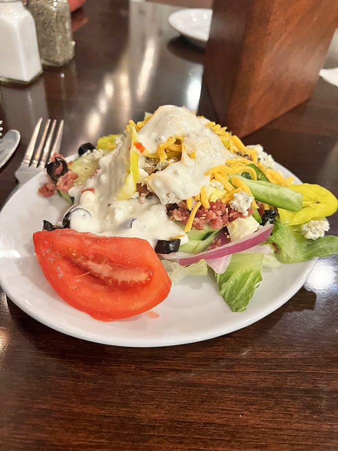 A salad that's actually trying—loaded with cheese, veggies, and enough toppings to make you momentarily forget about the prime rib. Almost.