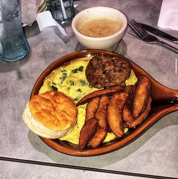 Breakfast served in a skillet isn't just a meal—it's a statement that your day deserves to start with eggs, sausage, and buttery biscuit perfection.
