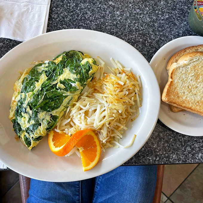 This spinach and feta omelet is breakfast artistry – fluffy eggs embracing savory fillings with the enthusiasm of a long-lost friend.