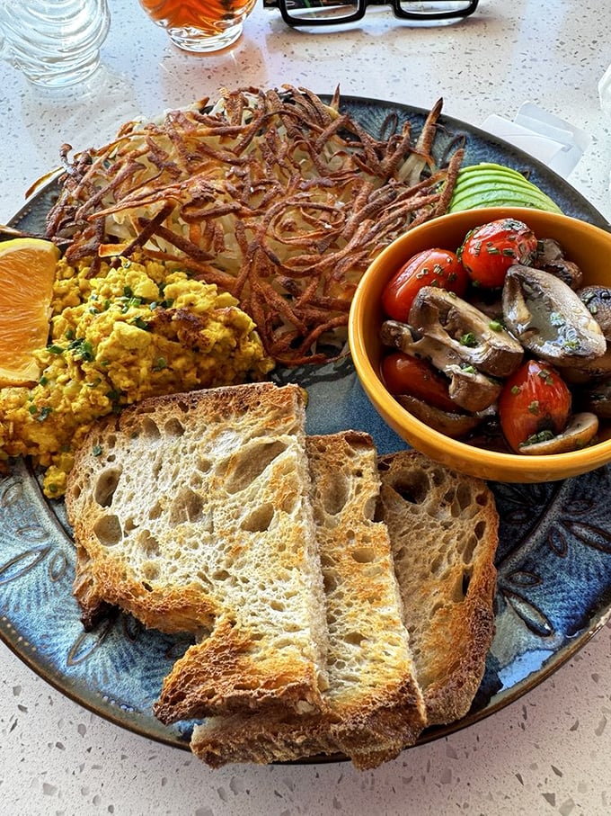 The breakfast standard reimagined—crispy hashbrowns, perfectly scrambled eggs, and artisanal toast that makes Wonder Bread weep with inadequacy.