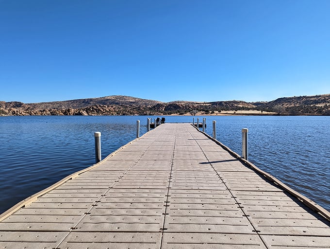 This wooden dock invites contemplation, fishing, or simply proving to your grandkids that you can still walk in a straight line.