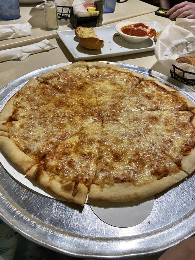Sometimes the simplest pizza speaks the loudest—this cheese pie whispers sweet nothings about the beauty of getting basics right.