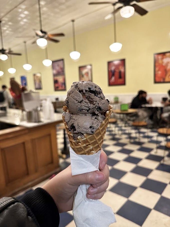 This cookies and cream cone isn't just dessert—it's a monument to the perfect marriage of textures in a handheld format.
